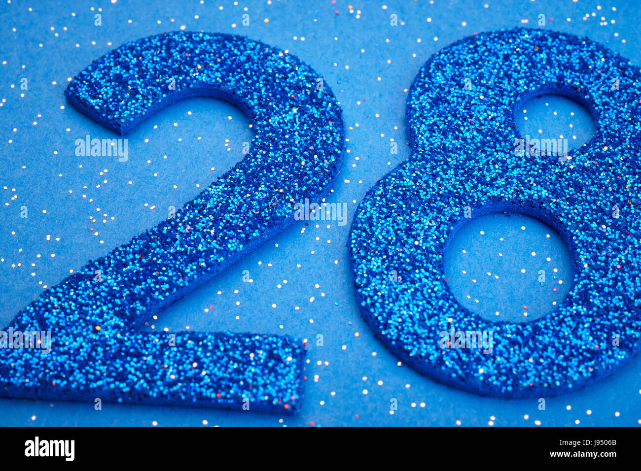 Number twentyeight blue color over a blue background. Anniversary Stock ...