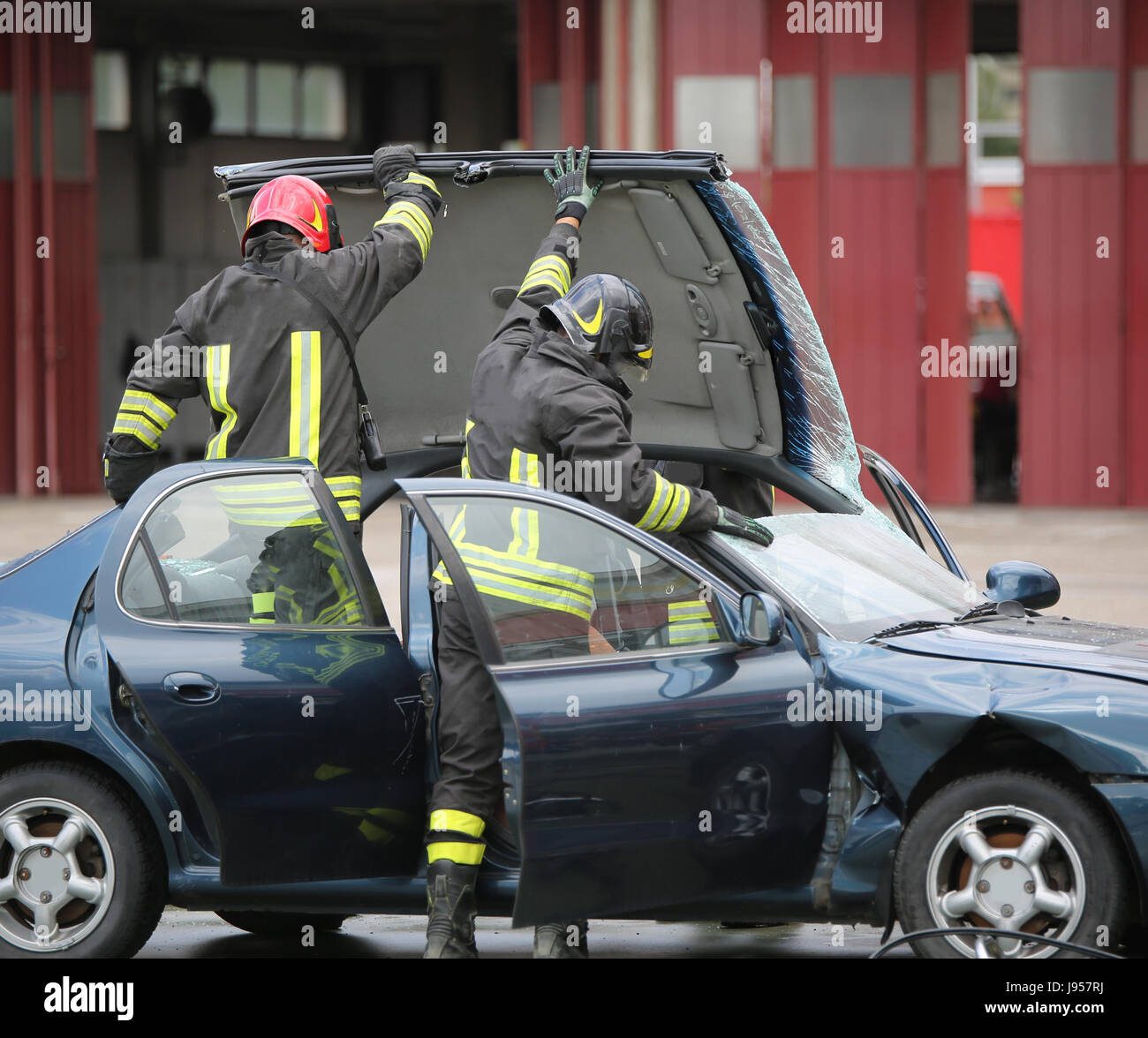 Firefighter team takes off the car roof to pull the wound after the car ...