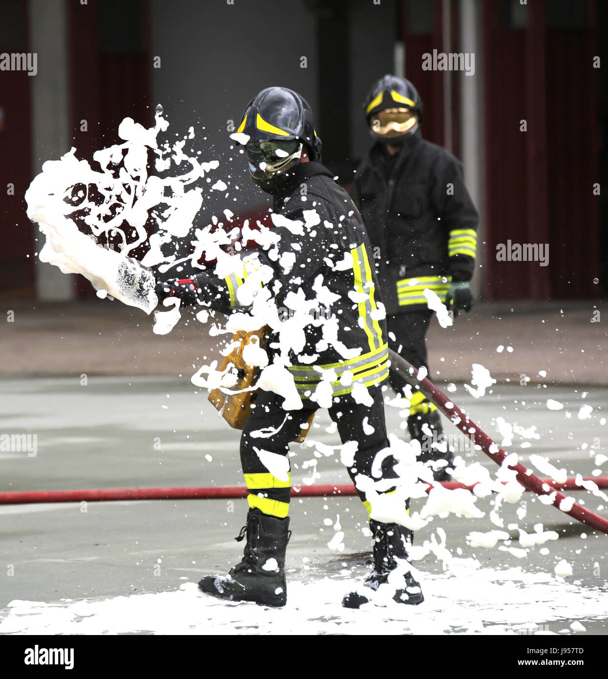 Firefighters while extinguishing the fire with a special fire ...