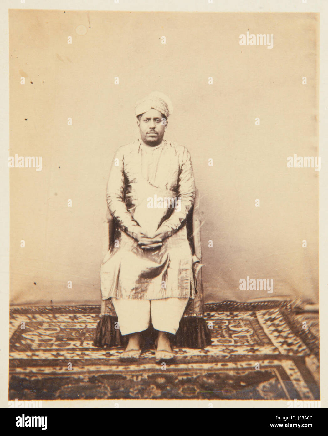 An 1868 portrait of the Rajah of Cochin, showcasing the traditional ...