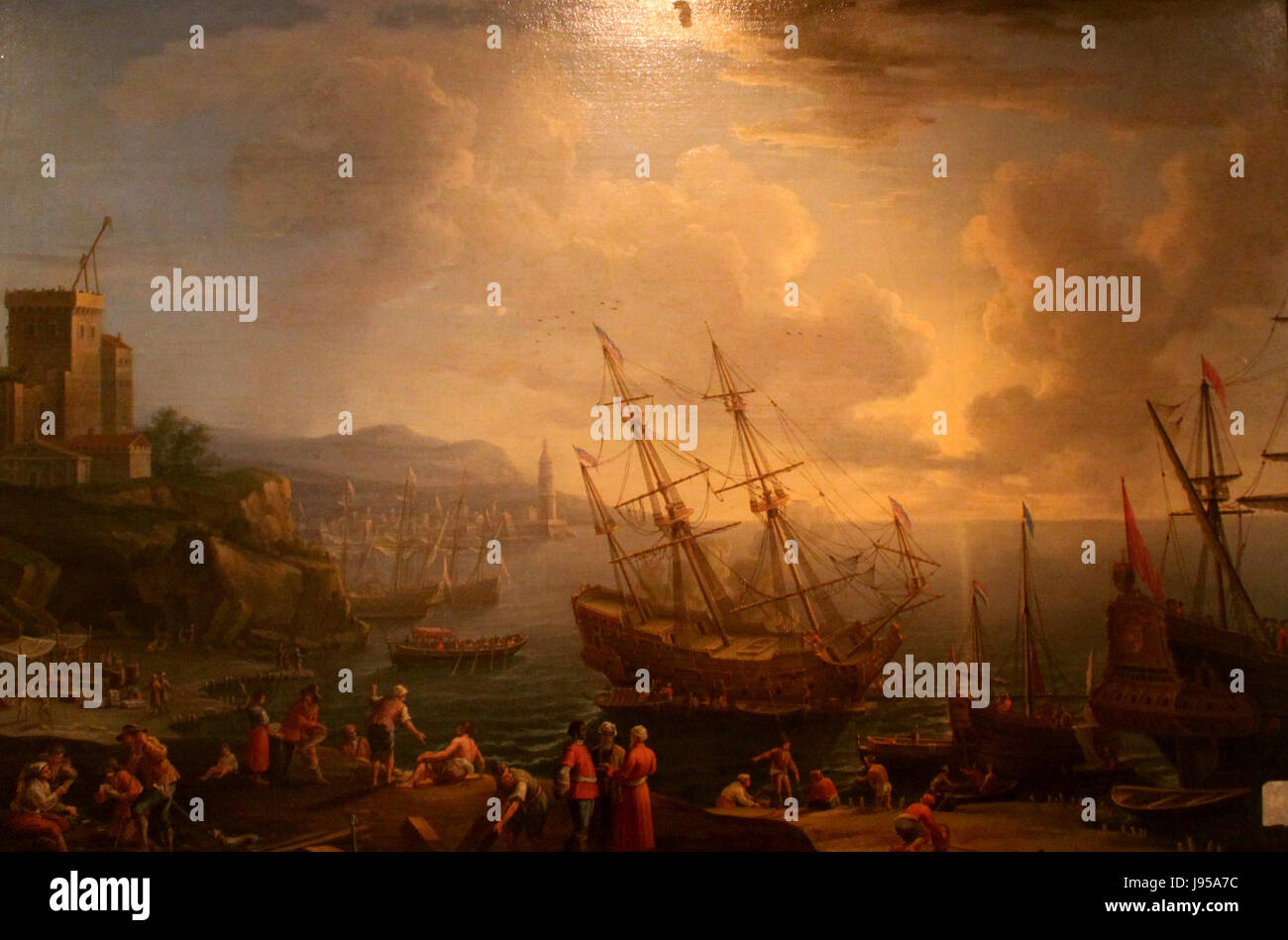 This painting by an unknown Dutch artist depicts a bustling seaport ...