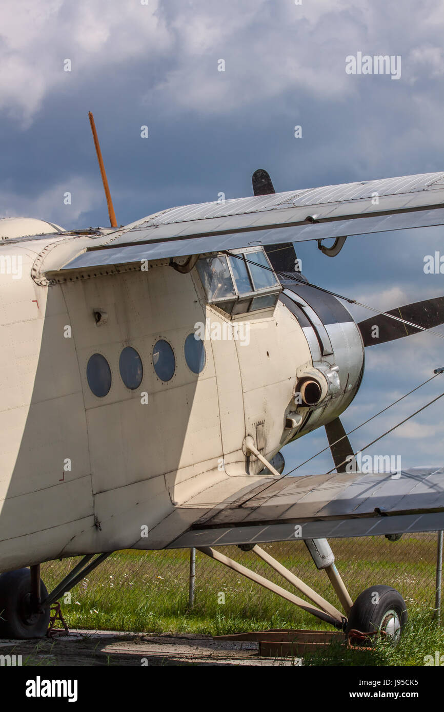 Old propeller biplane on the airfield in summer Stock Photo - Alamy