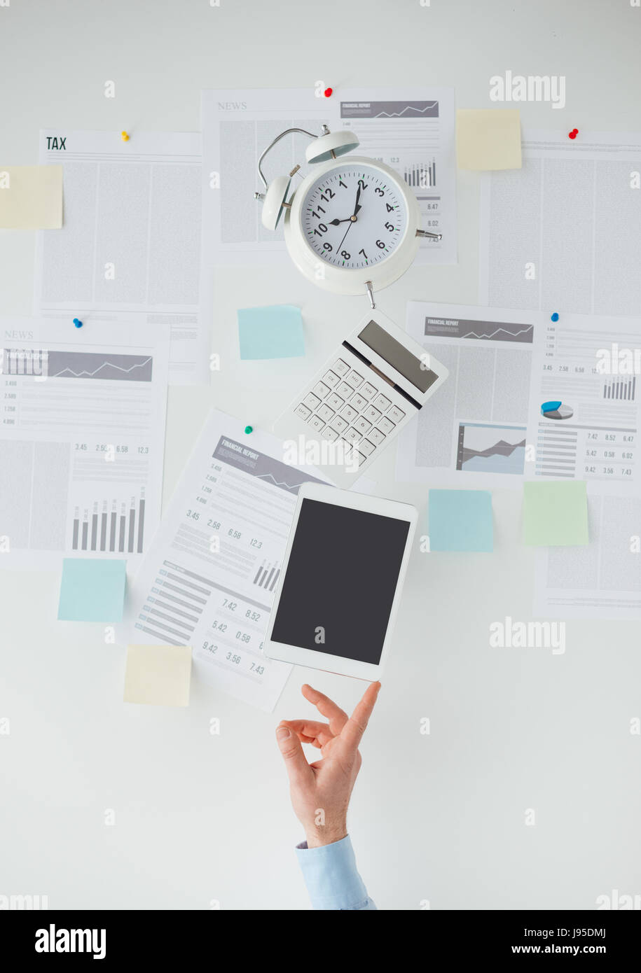 Businessman balancing clock calculator hi-res stock photography and ...