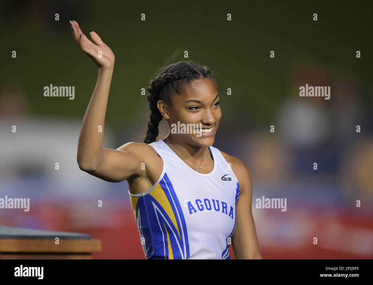 Tara Davis of Agoura waves after winning the girls 100m hurdles, long ...