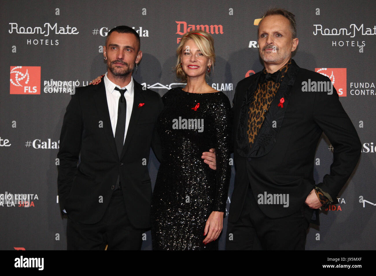 Designer David Delfin with actress Belen Rueda and singer Miguel Bose ...