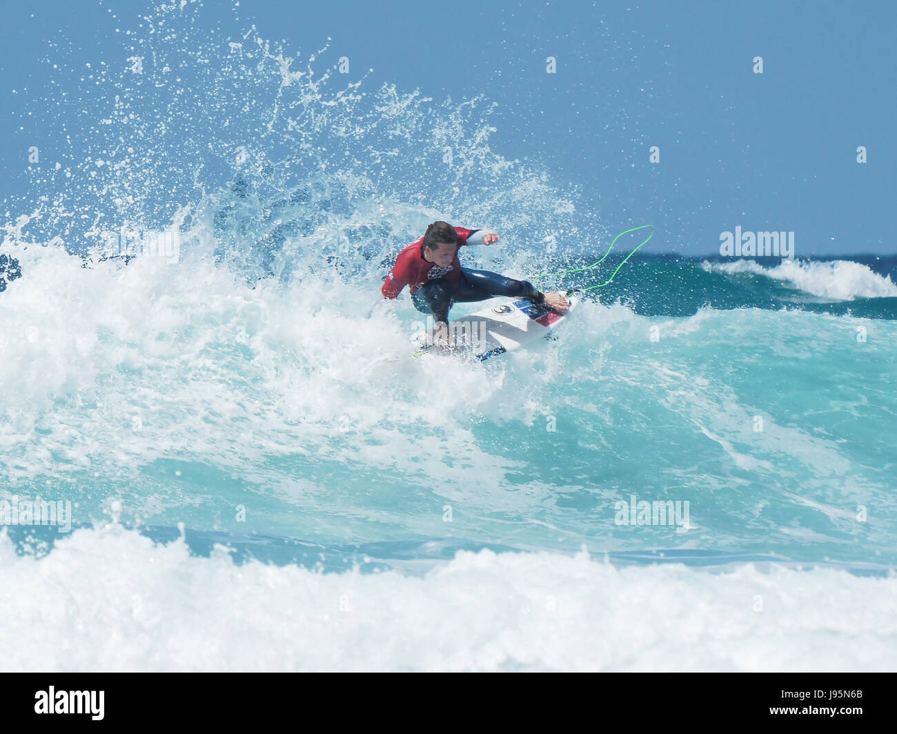 UK pro surfing in the sunshine at Watergate Bay Cornwall Stock Photo ...