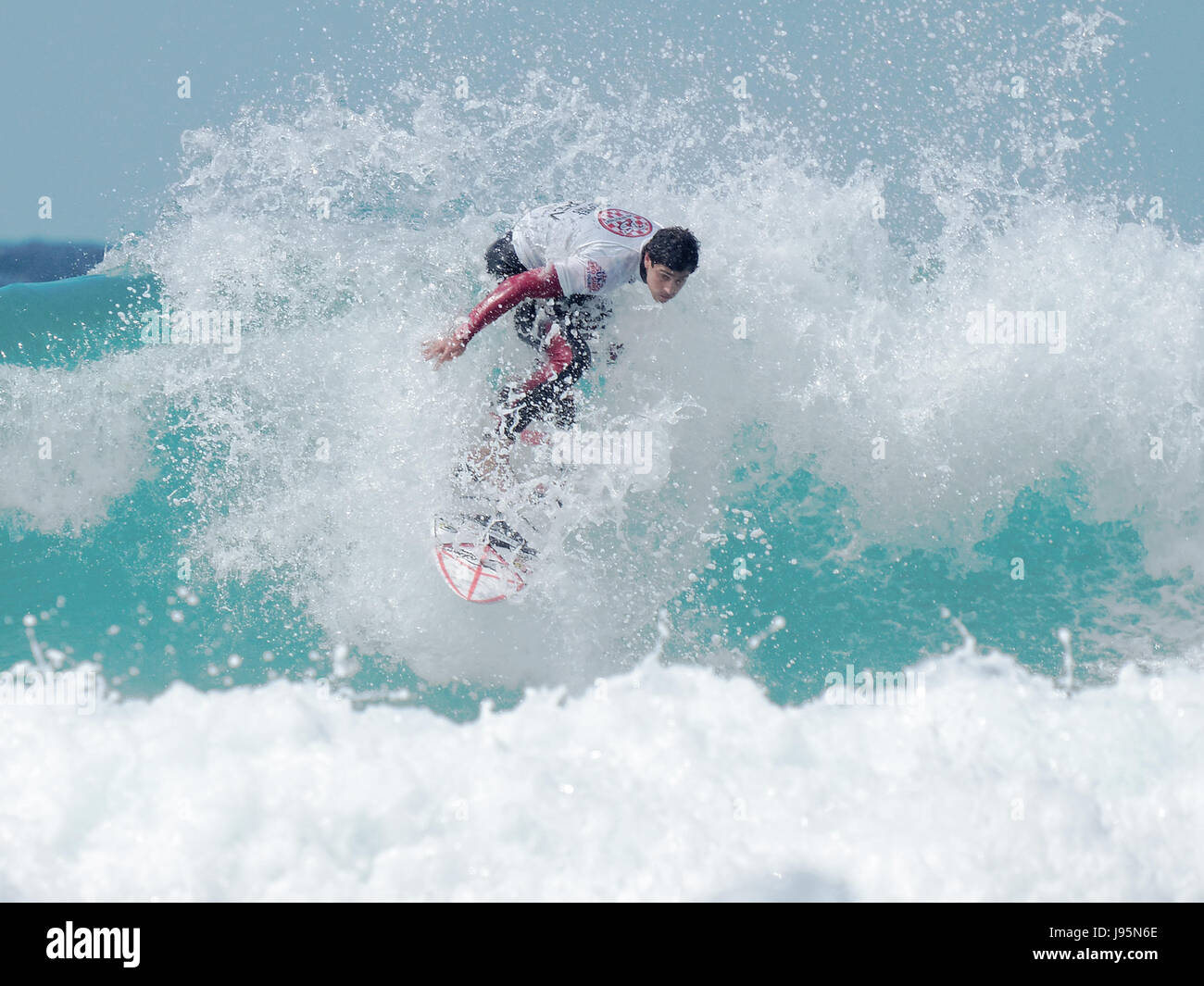 UK pro surfing in the sunshine at Watergate Bay Cornwall Stock Photo ...