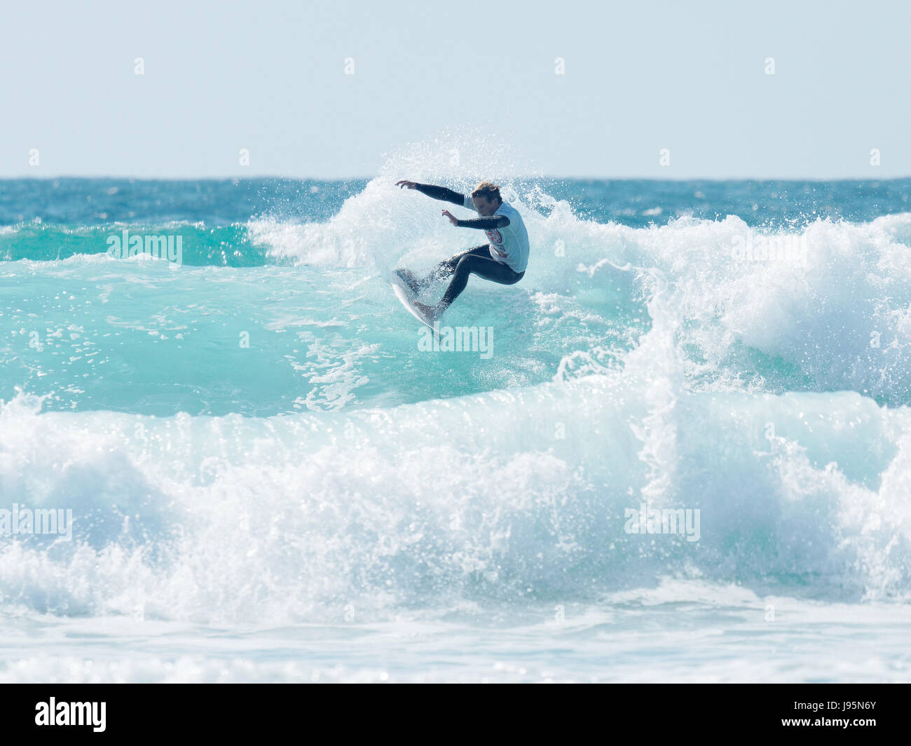UK pro surfing in the sunshine at Watergate Bay Cornwall Stock Photo ...