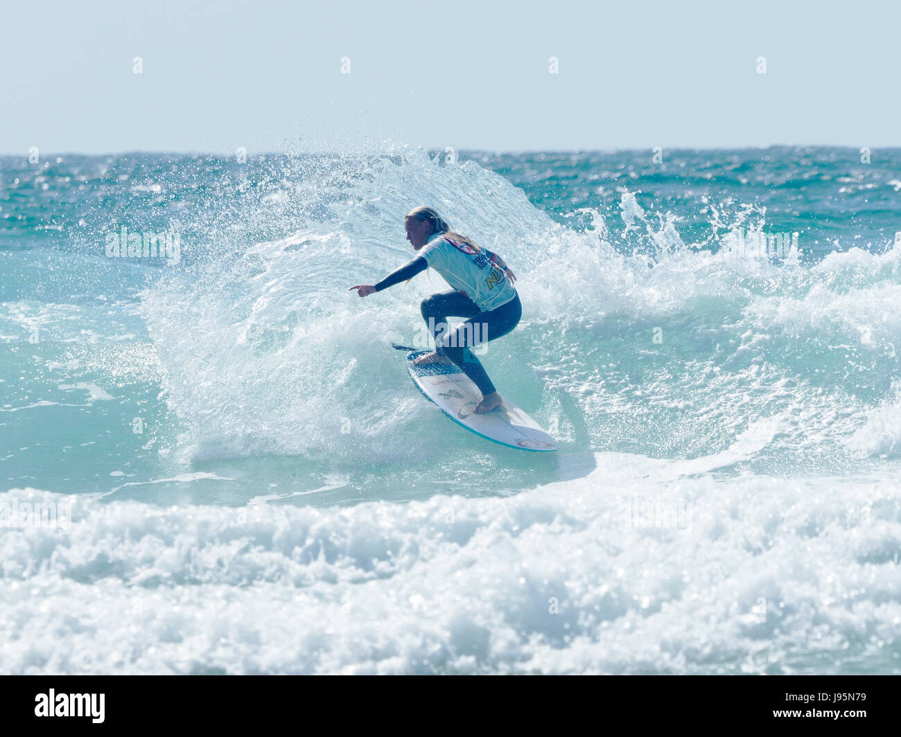 UK pro surfing in the sunshine at Watergate Bay Cornwall Stock Photo ...