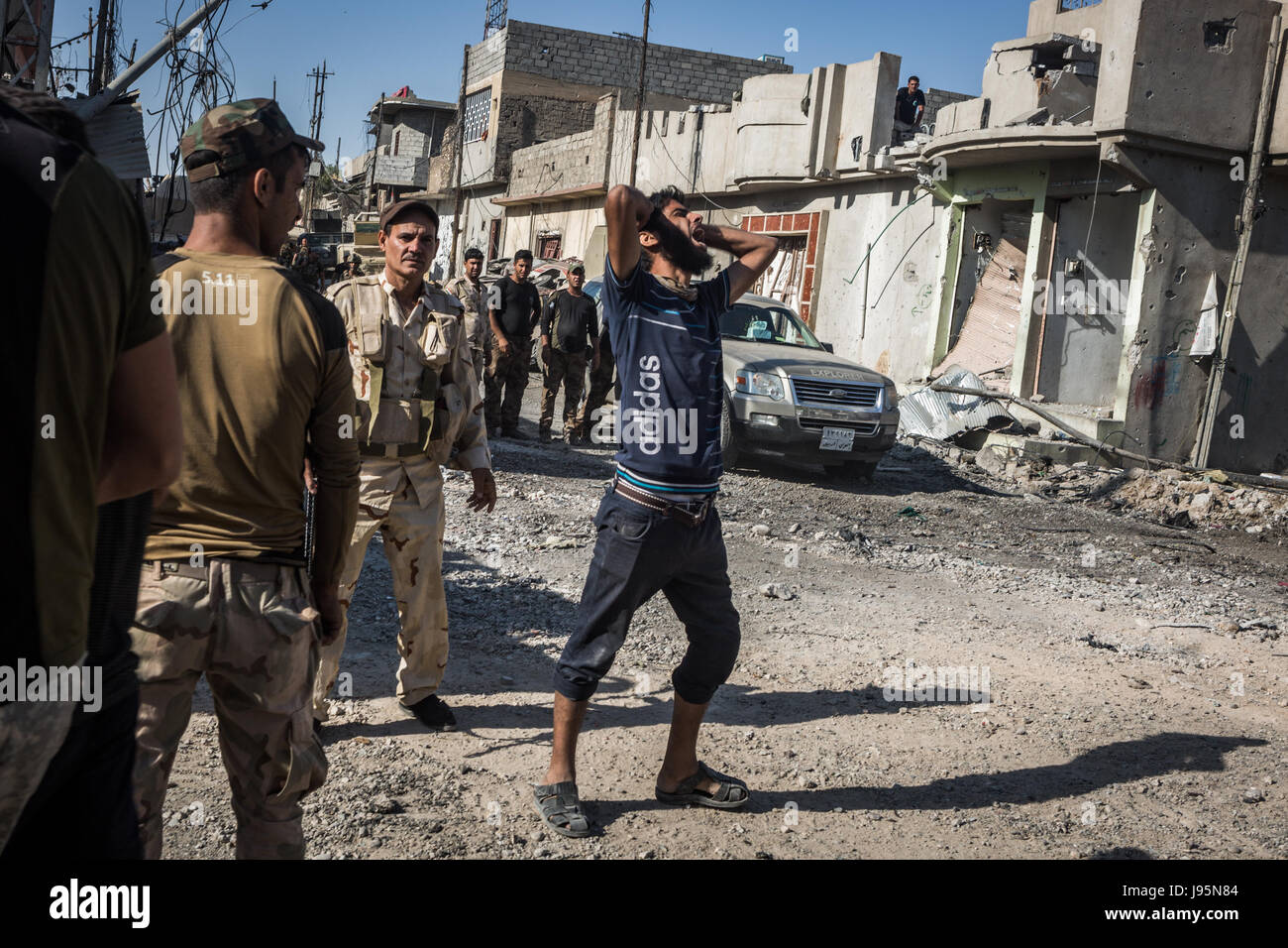 dpatop - A man cries out after reaching the safety of Iraqi troops ...