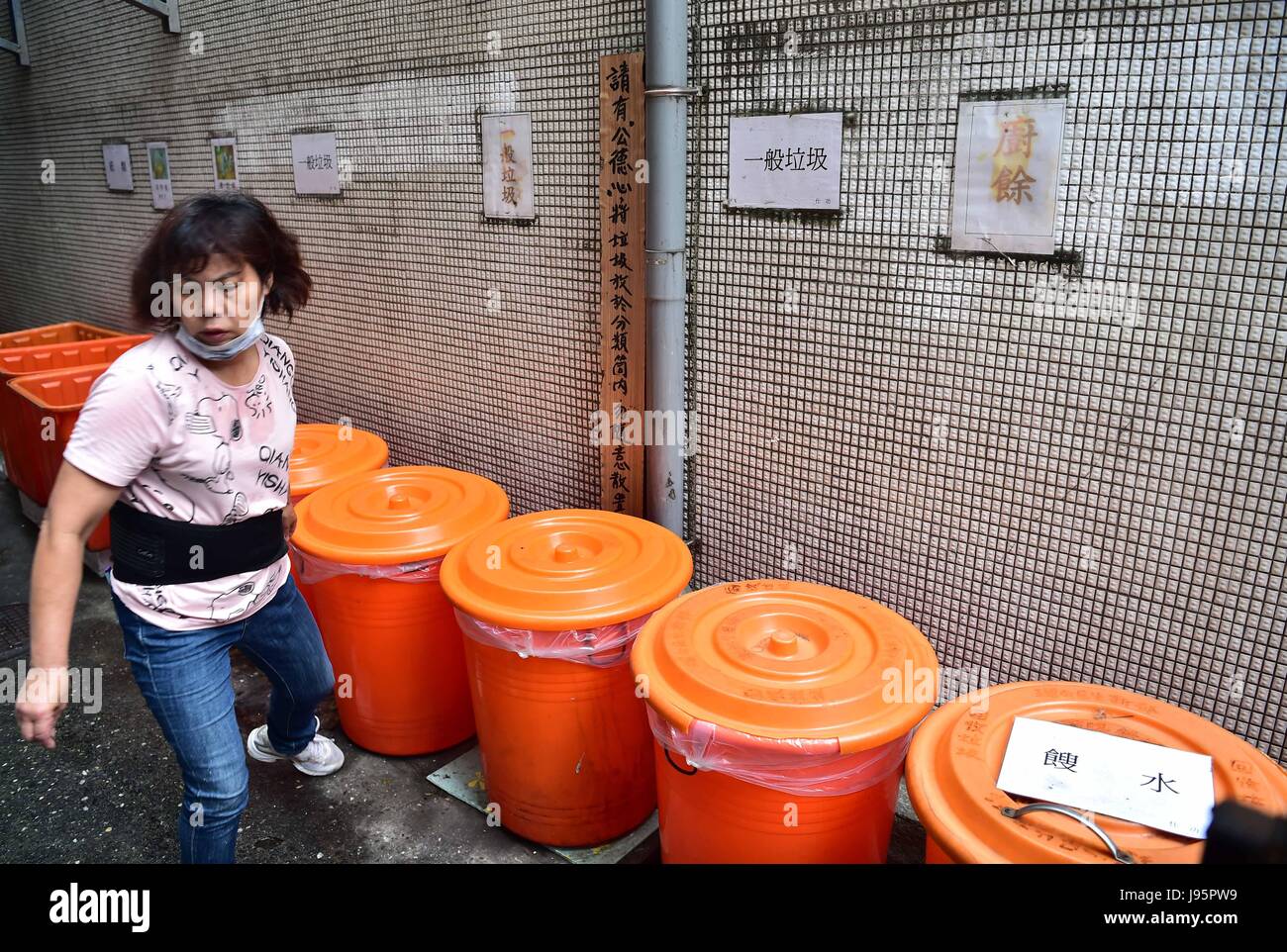 Taipei's Taiwan. 31st May, 2017. A worker classifies garbage at a ...