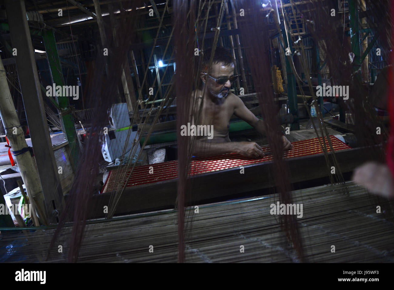 Bangladeshi woman weaving in hi-res stock photography and images - Alamy