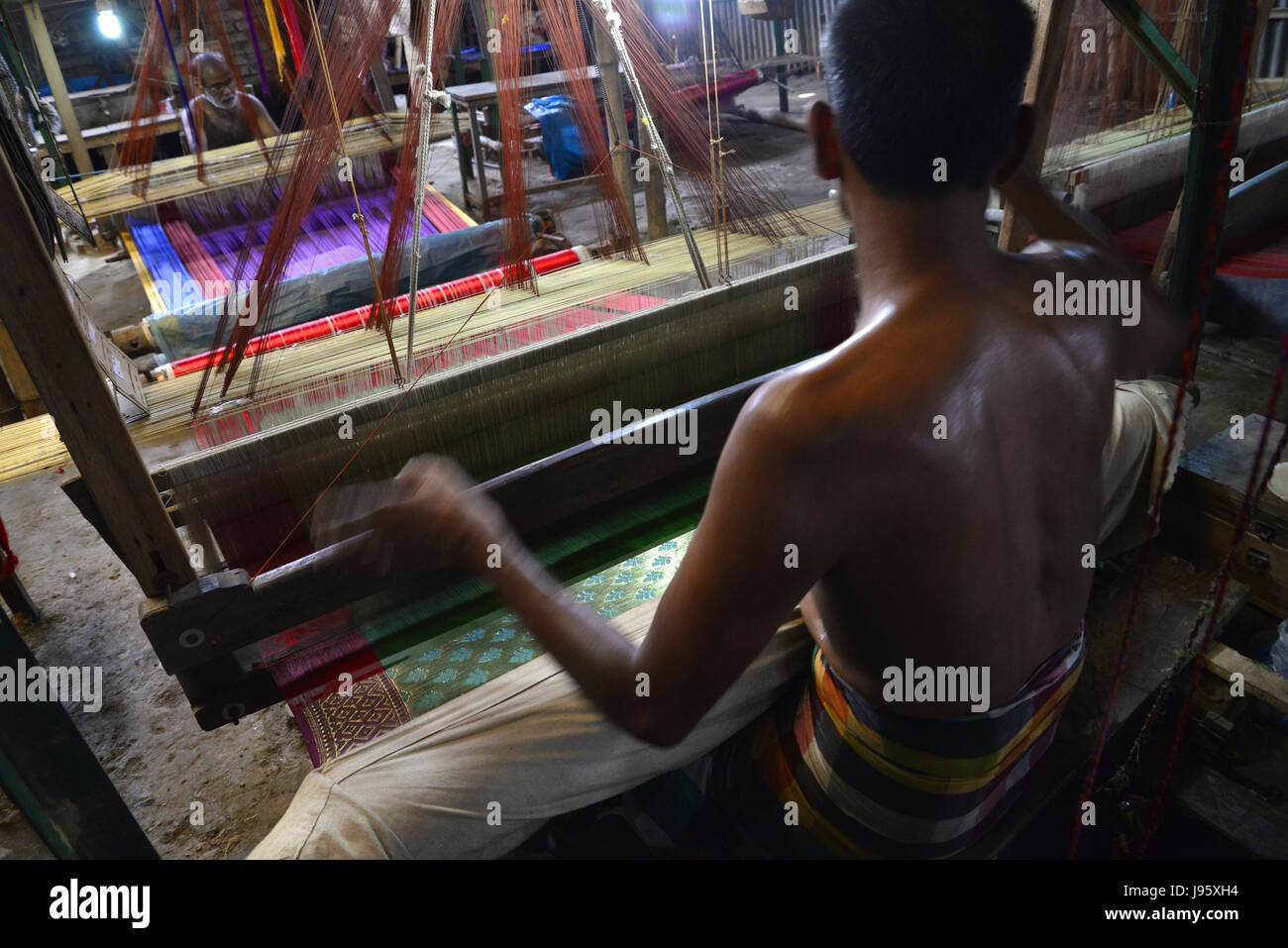 Dhaka, Bangladesh. 4th Jun, 2017. A Bangladeshi weaver weaves Benarasi sari (Woman Wear) on a ...