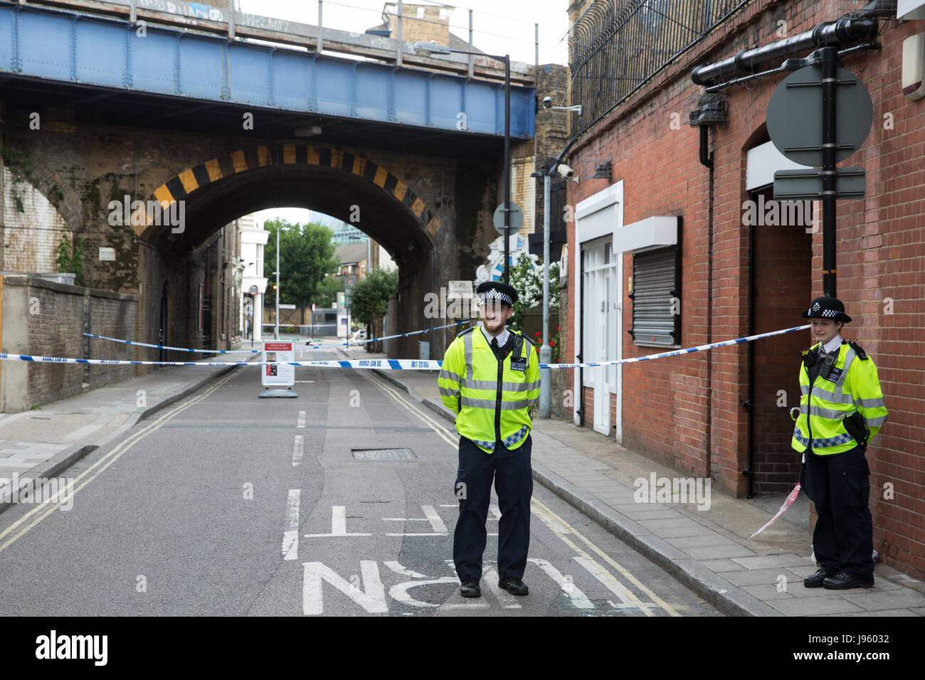 London, UK. 5th June, 2017. Police officers stand at the perimeter of ...
