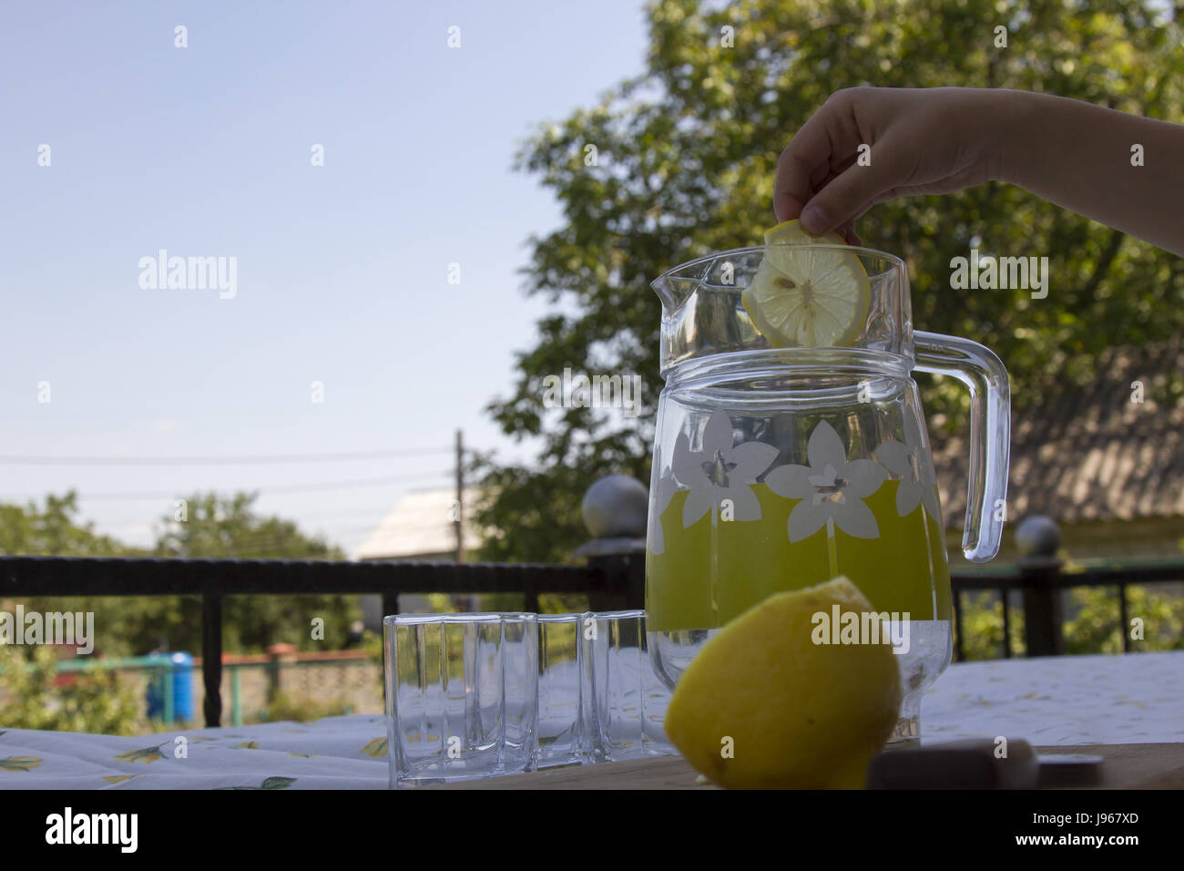 Lemonade Hand lemon decanter Stock Photo - Alamy