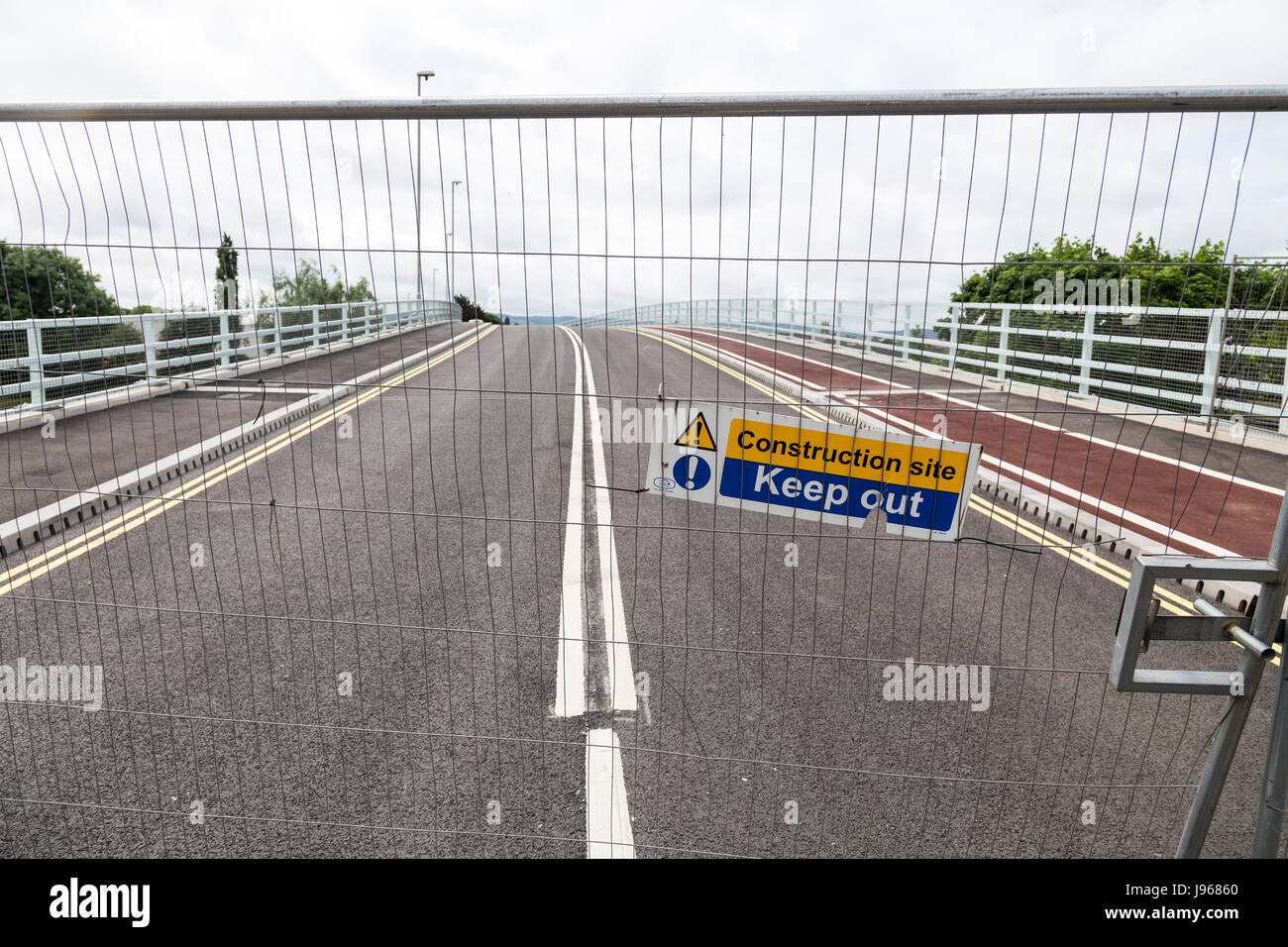 Barriers in place and Keep Out signs at the approach to an unfinished ...