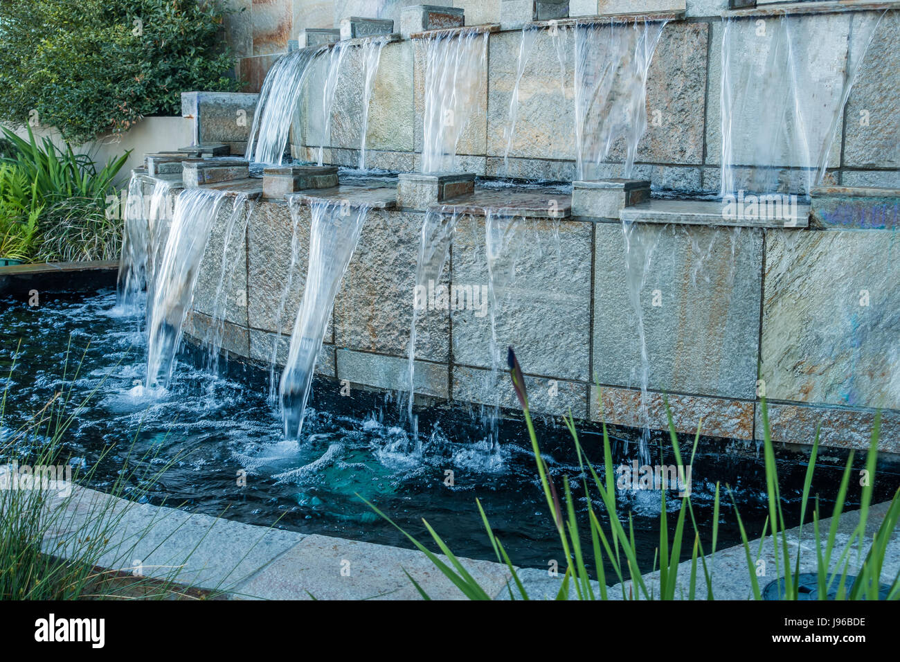 Many streams of water cascade down this fountain Stock Photo - Alamy