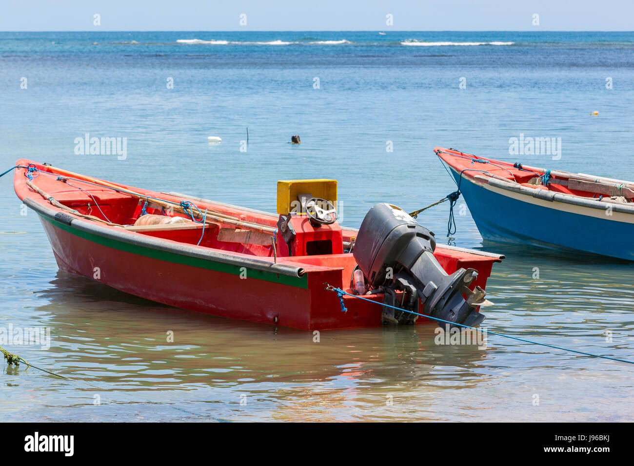 Colored small boat on sea Stock Photo - Alamy