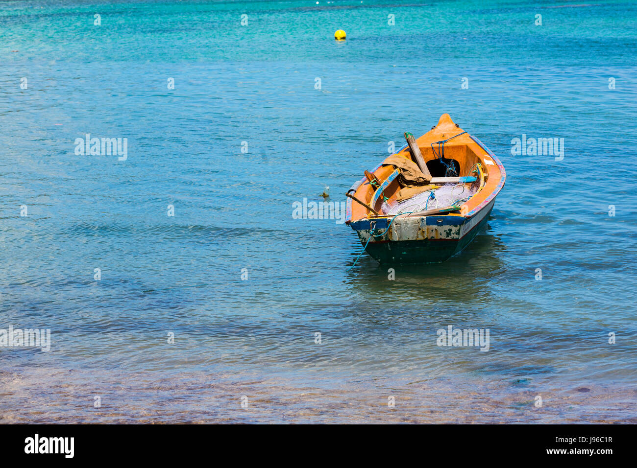 Colored small boat on sea Stock Photo - Alamy