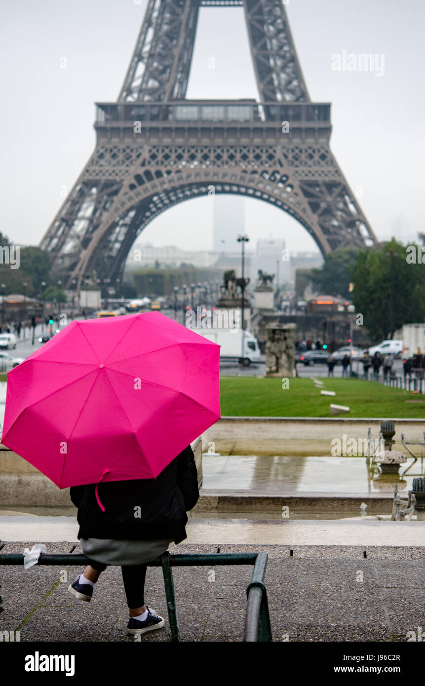 Woman sitting in the rain Stock Photo - Alamy