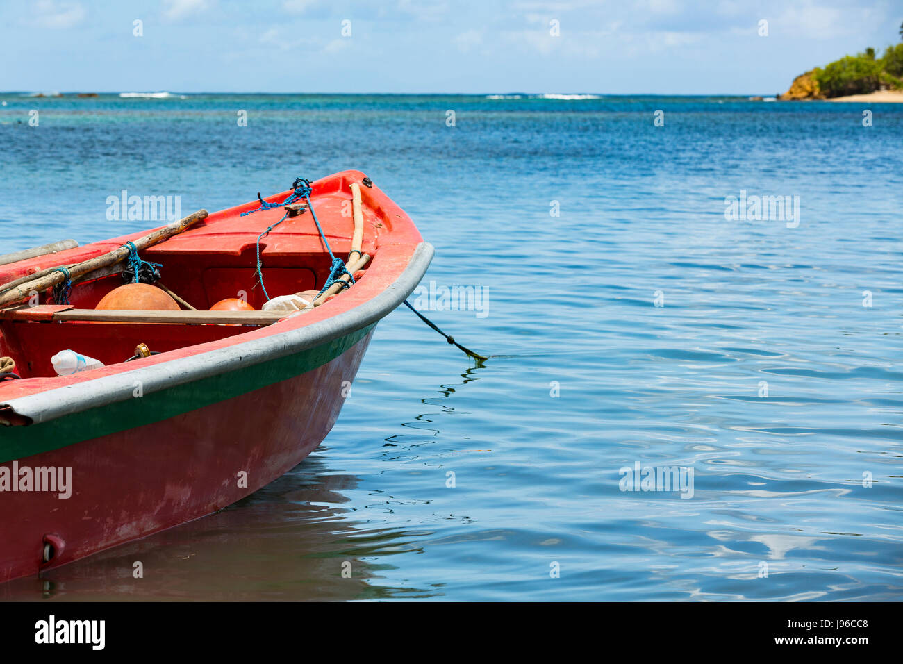 Colored small boat on sea Stock Photo - Alamy