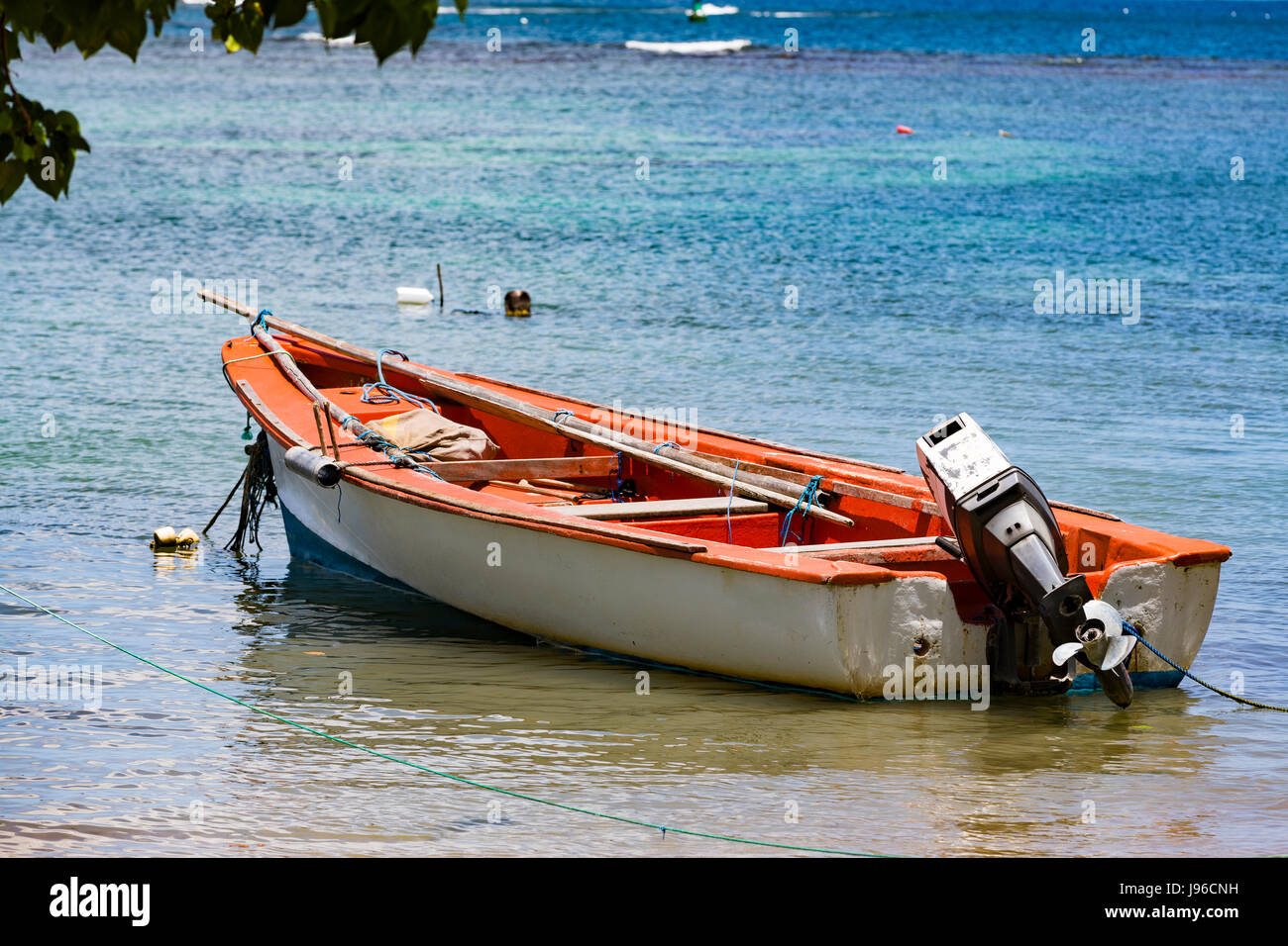 Colored small boat on sea Stock Photo - Alamy