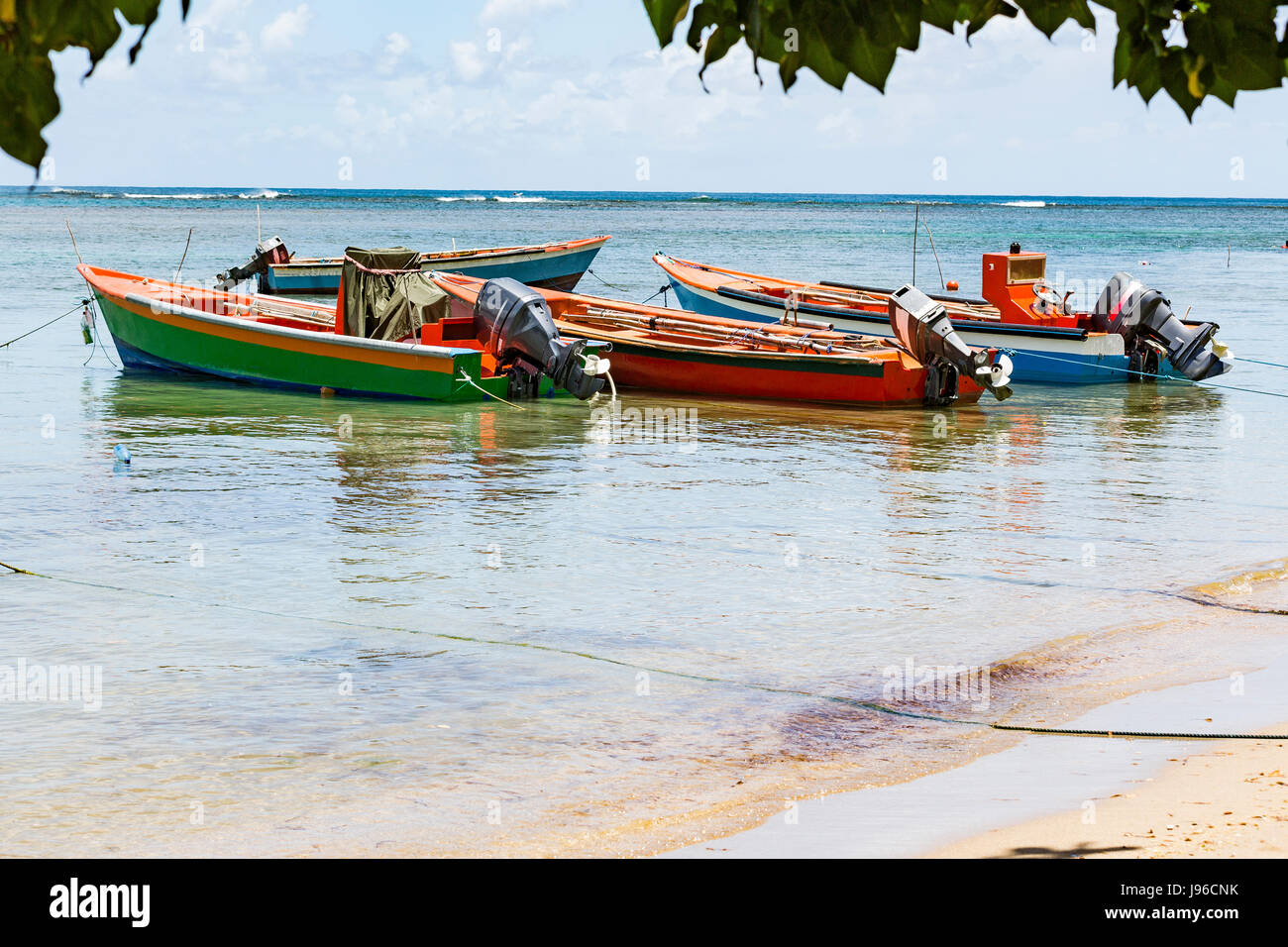 Colored small boat on sea Stock Photo - Alamy