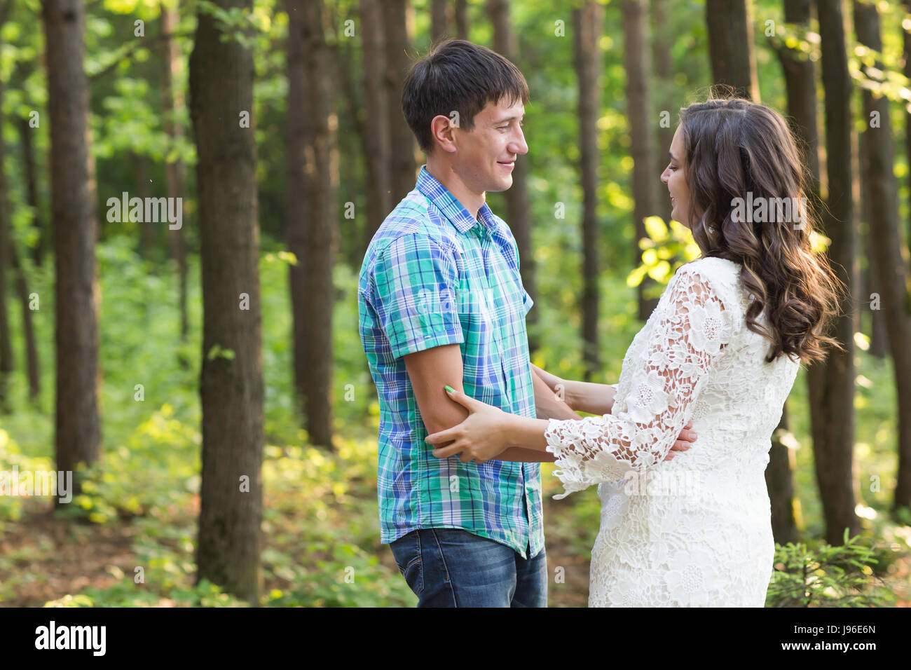 Closeup photo of romantic couple outdoors, side view Stock Photo - Alamy