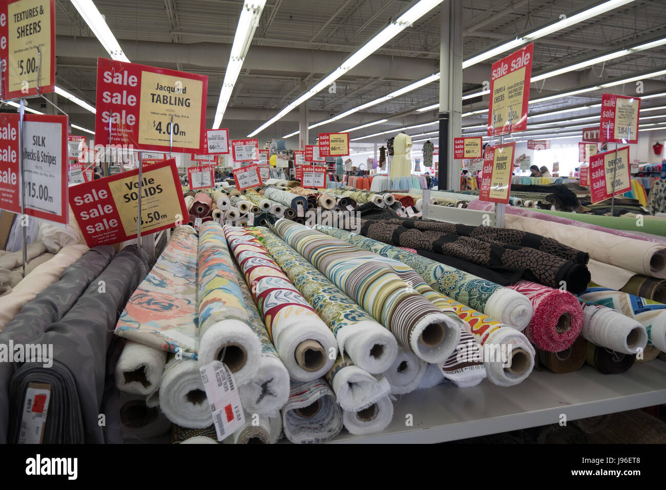 Rolls of fabric in a fabric store Stock Photo - Alamy