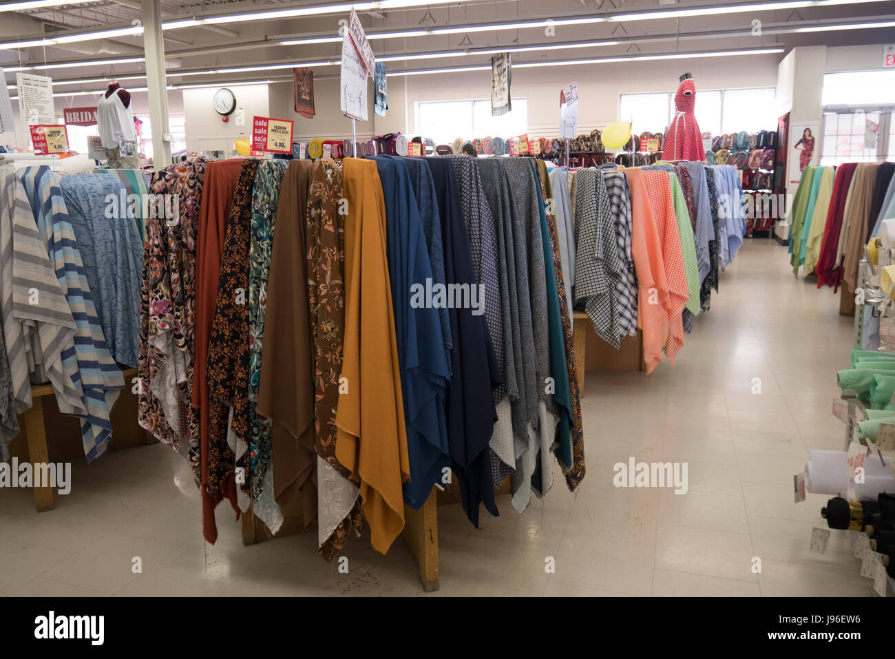 Rolls of fabric in a fabric store Stock Photo - Alamy