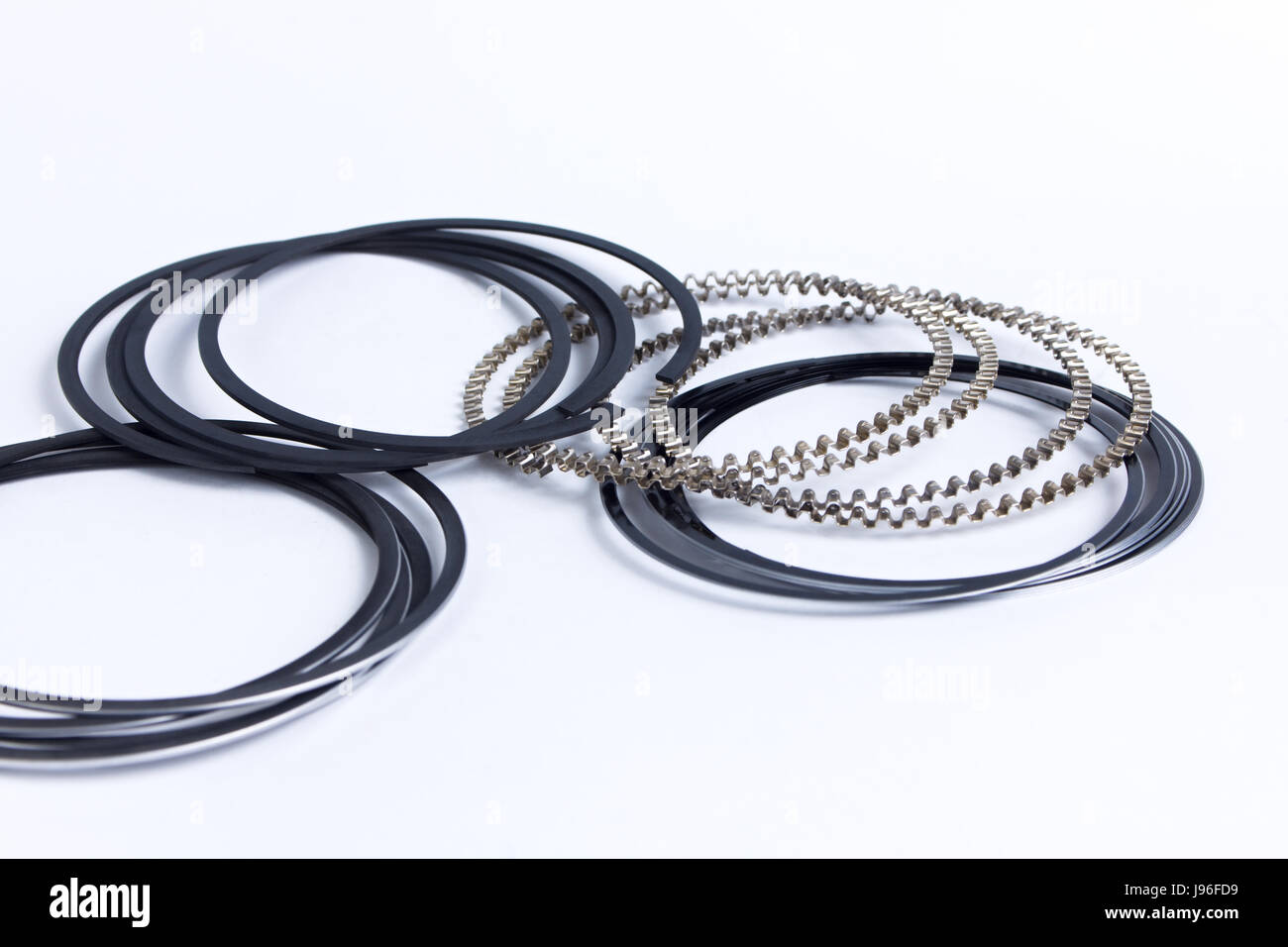 Spare parts for car piston rings on white isolated. New original ...