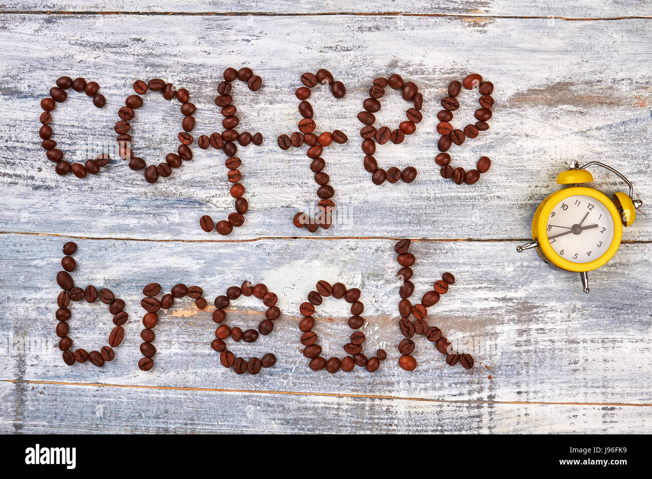 Coffee break and alarm clock Stock Photo - Alamy
