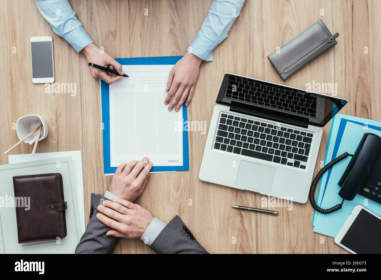 Signing a contract top view hi-res stock photography and images - Alamy