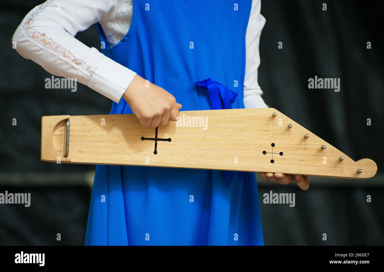 Girl with kannel performing on stage Stock Photo - Alamy