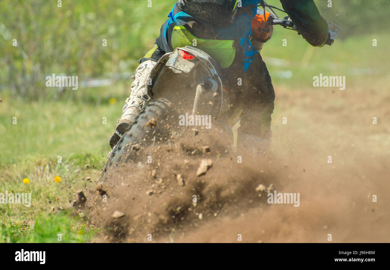 Professional motocross rider on the road. Back view Stock Photo - Alamy