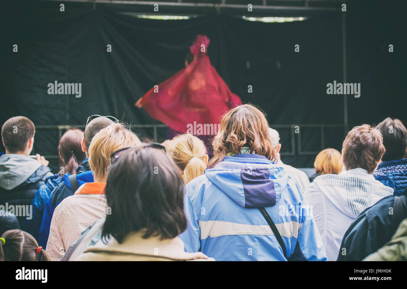 Woman magician showing tricks on the stage Stock Photo - Alamy