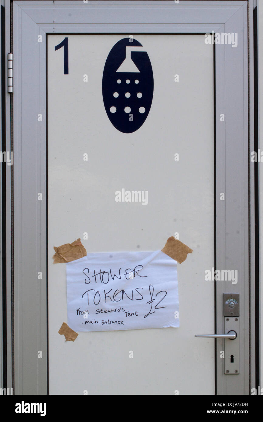 Pay shower cubicle at an outdoor music festival Stock Photo - Alamy