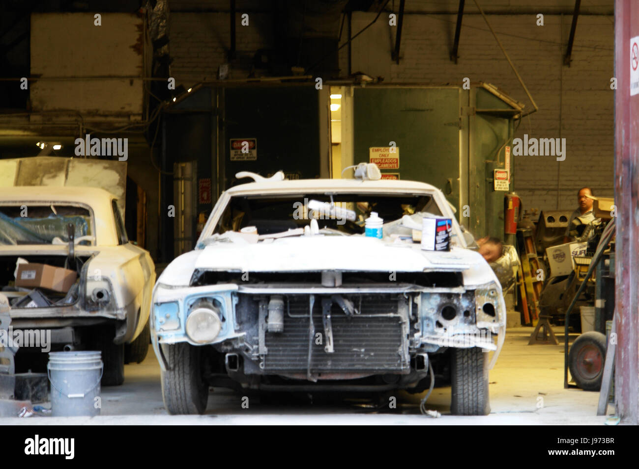 Broken car in workshop mechanical bodywork Stock Photo - Alamy