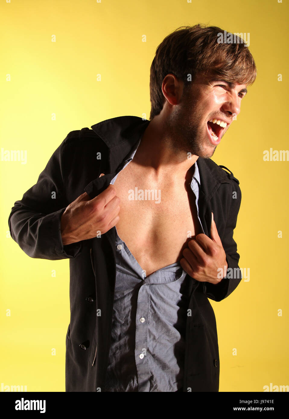 Man man ripping shirt hi-res stock photography and images - Alamy