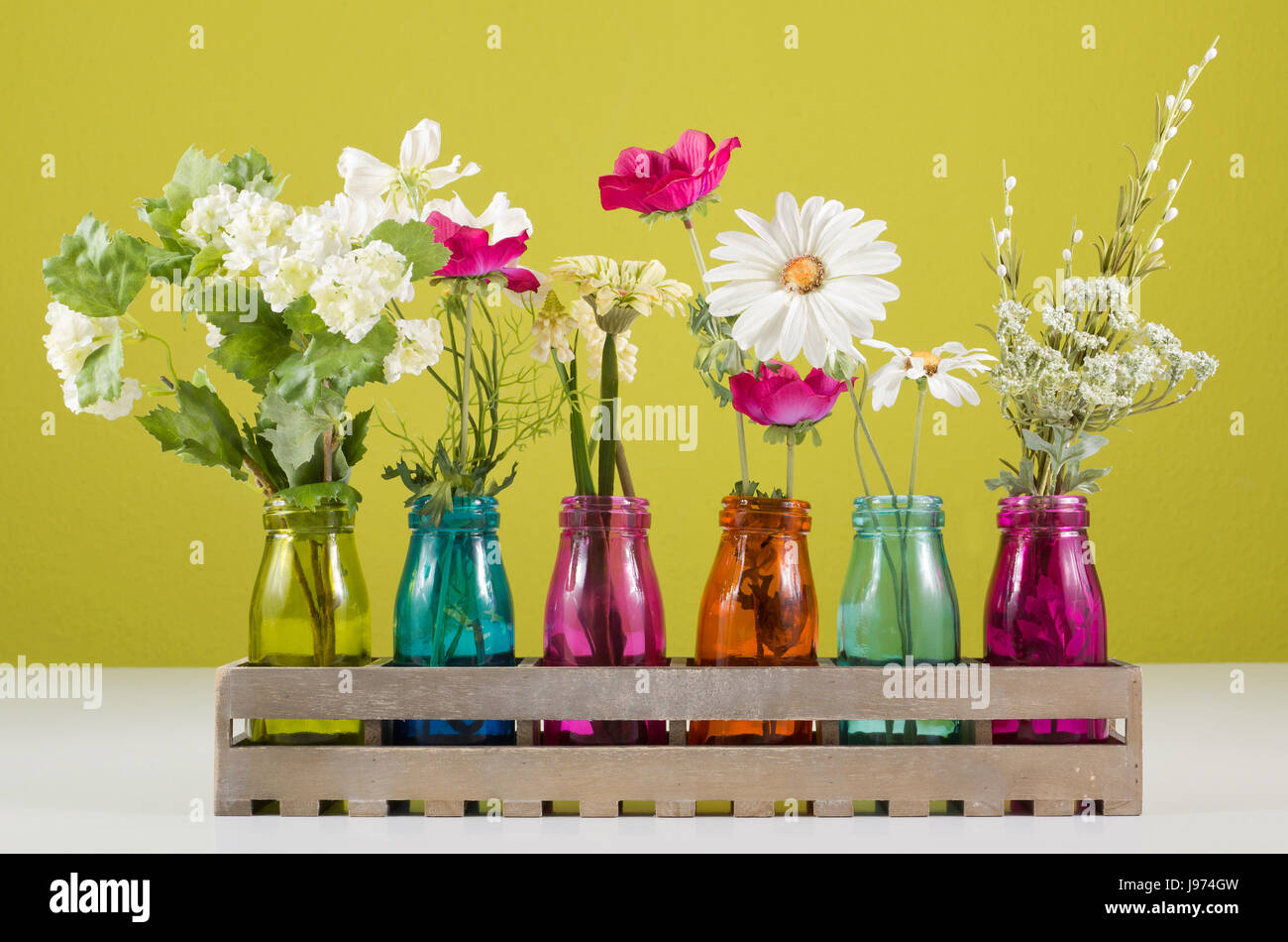 flowers in colorful vases Stock Photo - Alamy