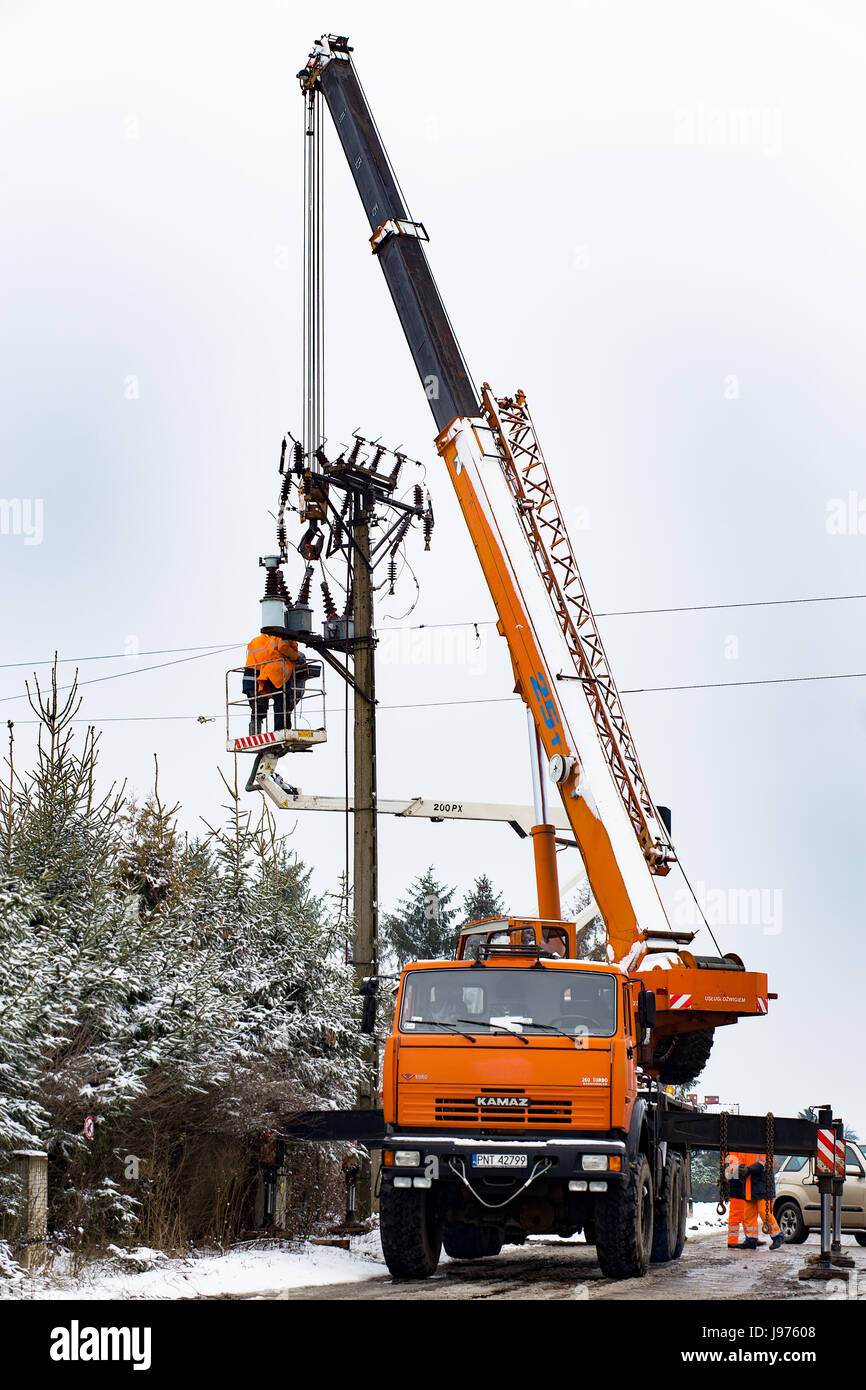 Electricians, wiremen working high on a pylon, connecting wires Stock ...
