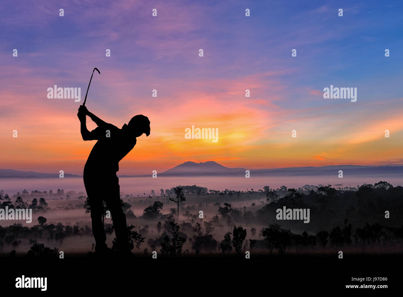 silhouette of golfers hit sweeping and keep golf course in the summer ...