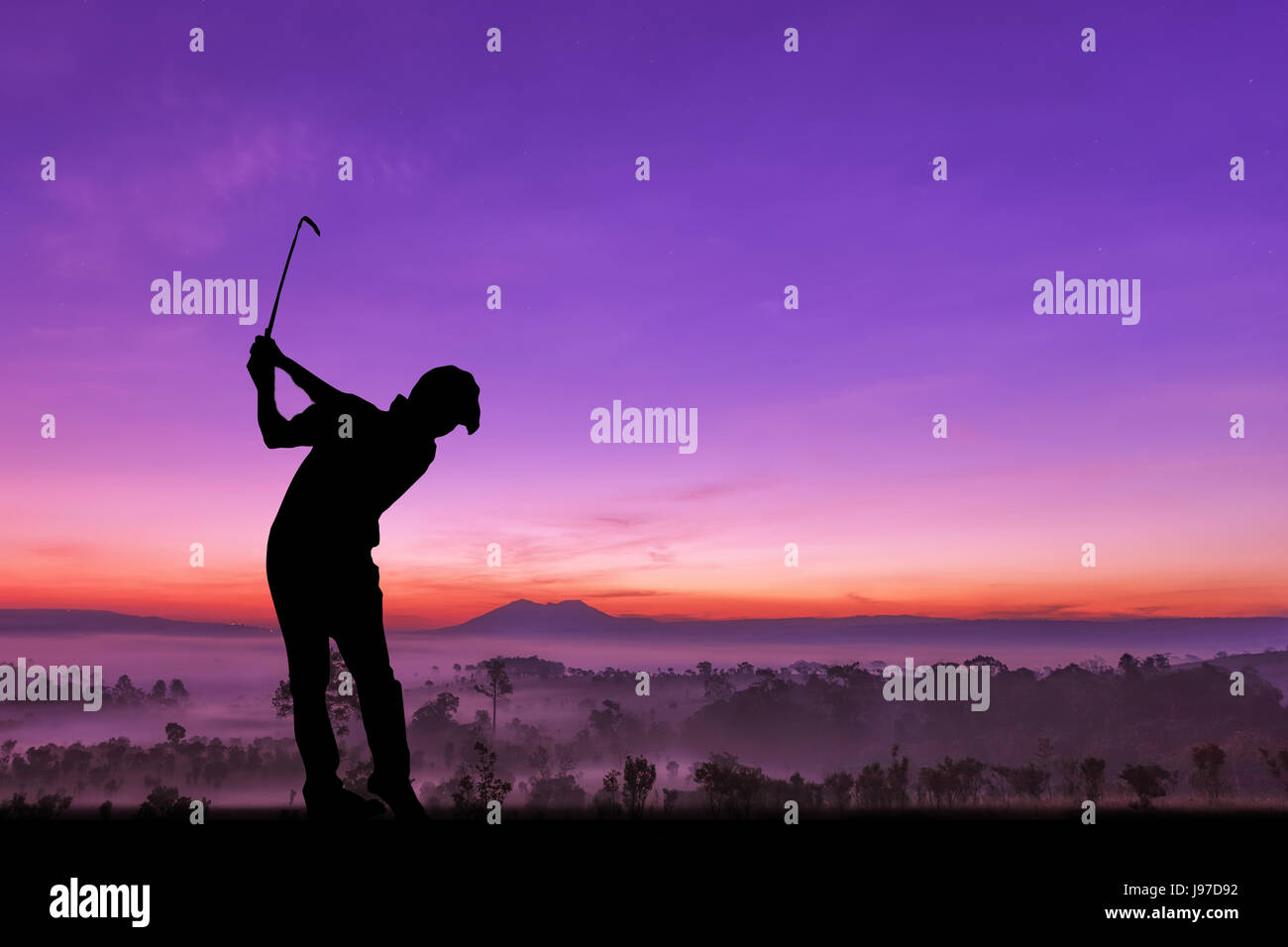 silhouette of golfers hit sweeping and keep golf course in the summer ...