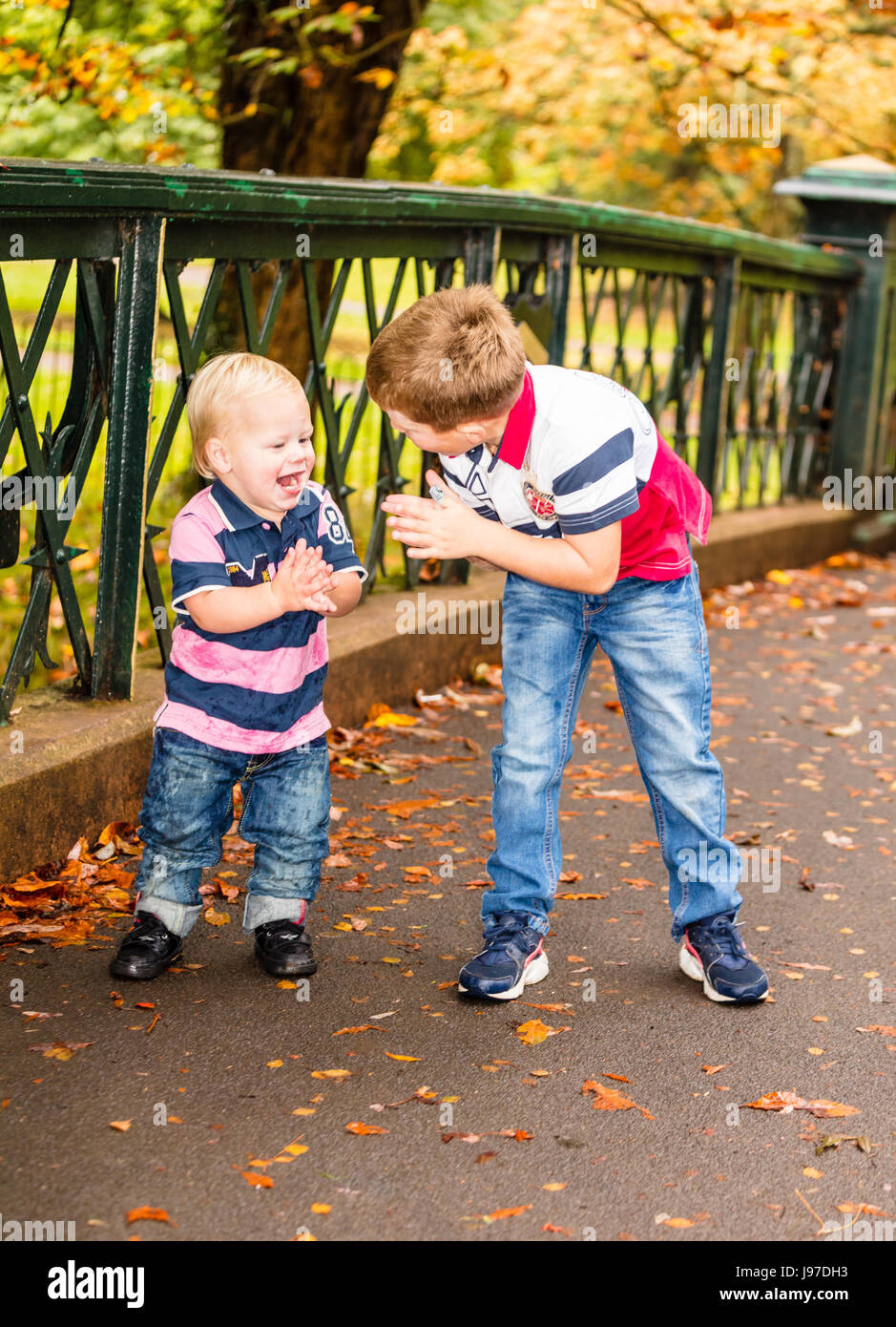 Two boys playing in the park hi-res stock photography and images - Alamy