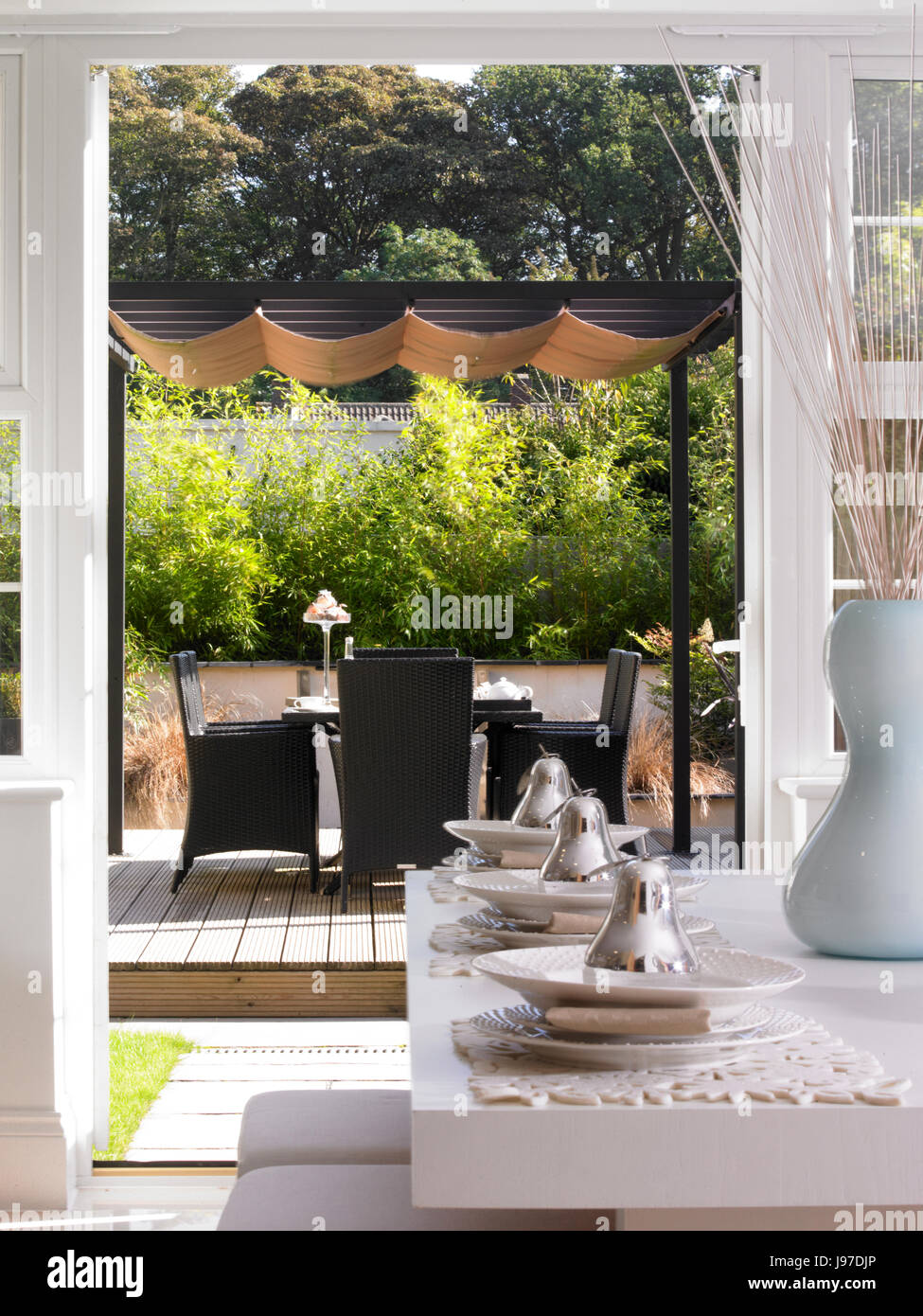 Dining room and garden view Stock Photo - Alamy