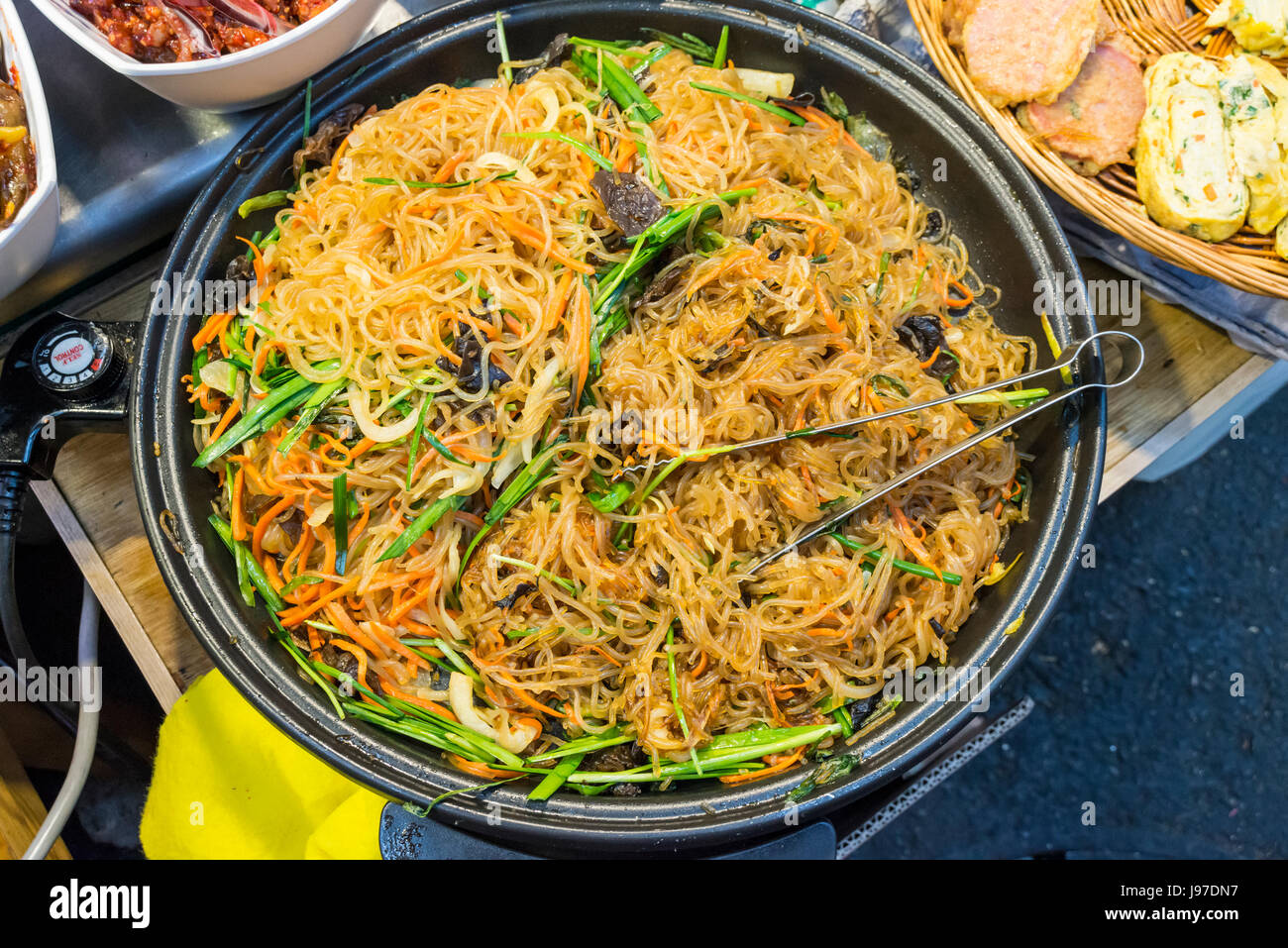 Chapchae - Korean dish: sweet potato glass noodles cooked with ...