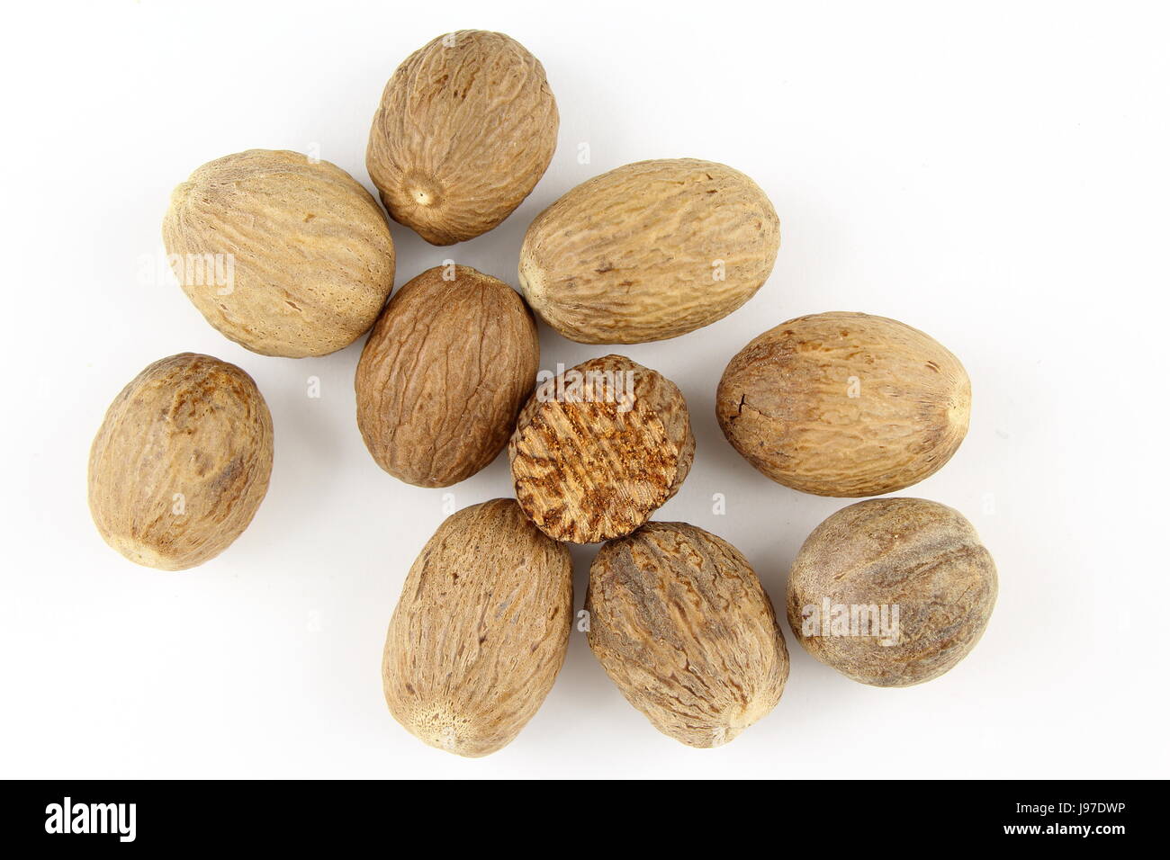 composition of nutmeg seeds isolated on a white background Stock Photo ...