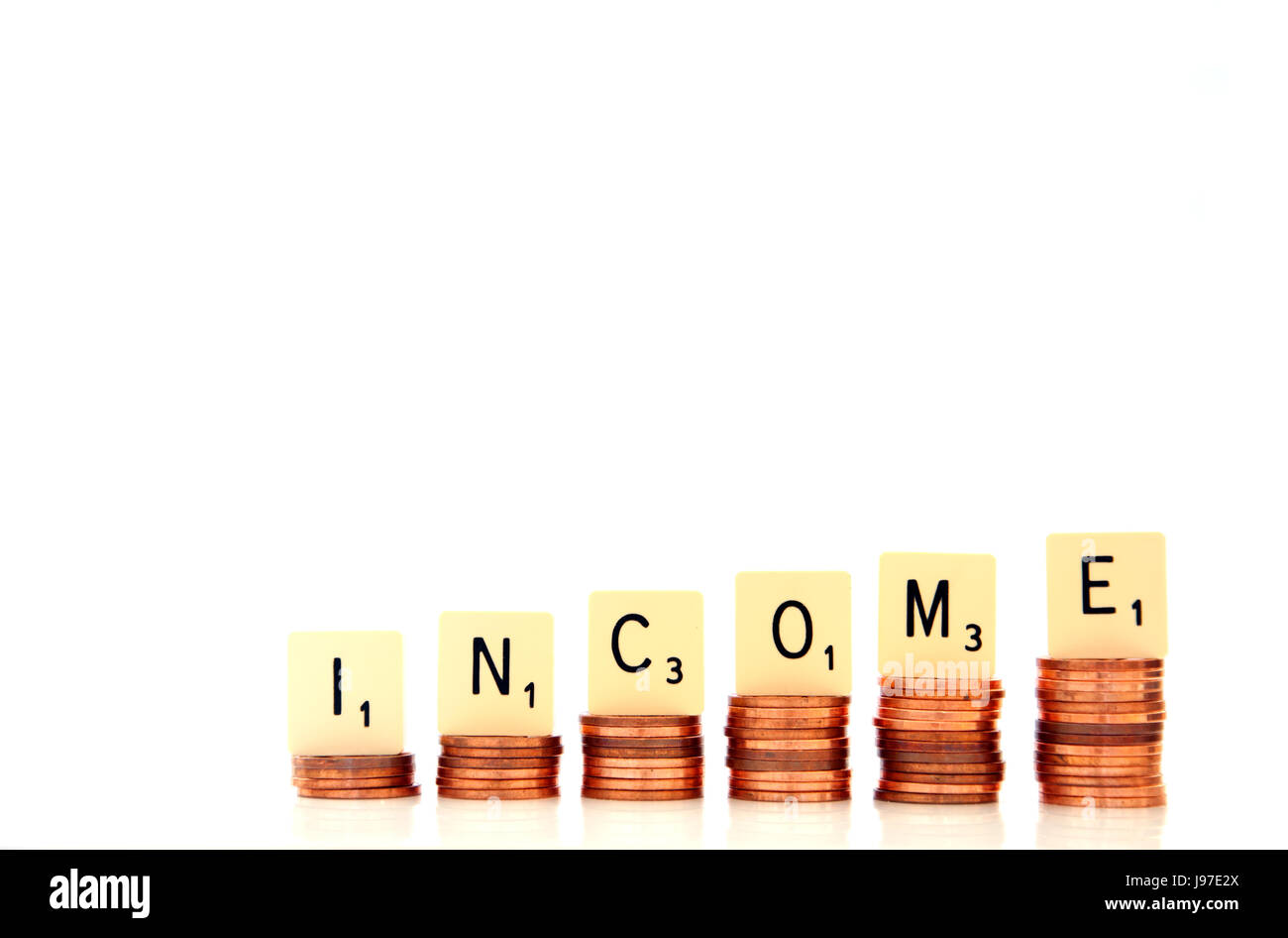 Rising income displayed in coins on white background Stock Photo - Alamy