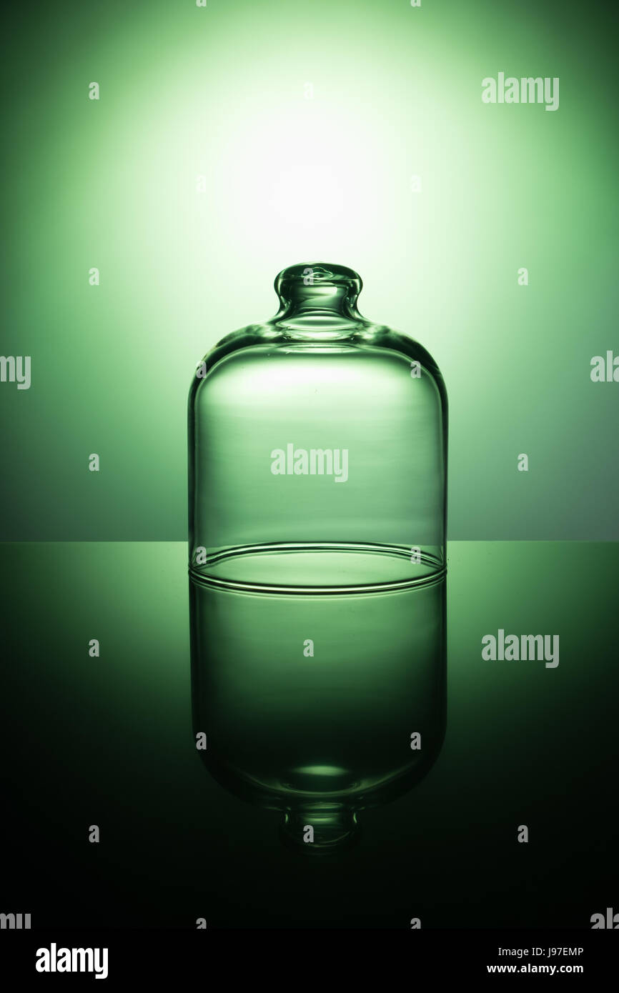 Empty glass jar on light green background Stock Photo - Alamy