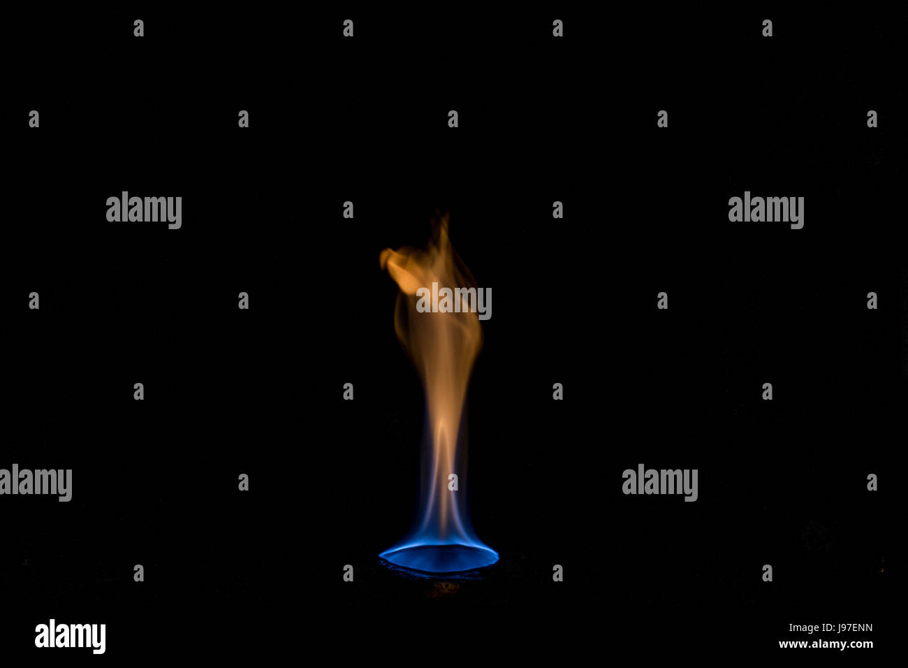 Fire with blue flamed base and orange flames towards top with circular ...